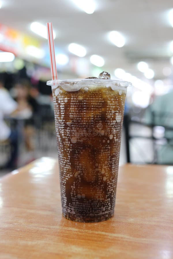 Cold cola in a glass. stock image. Image of table, tube - 87984487