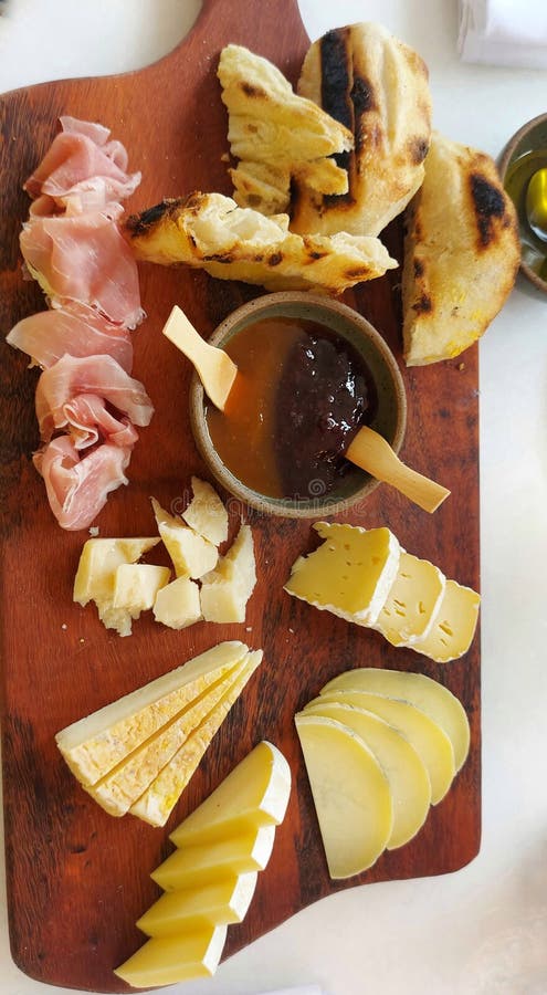 Cold Cuts Board with a Variety of Cheeses, Ham and Pepper Jam Stock ...