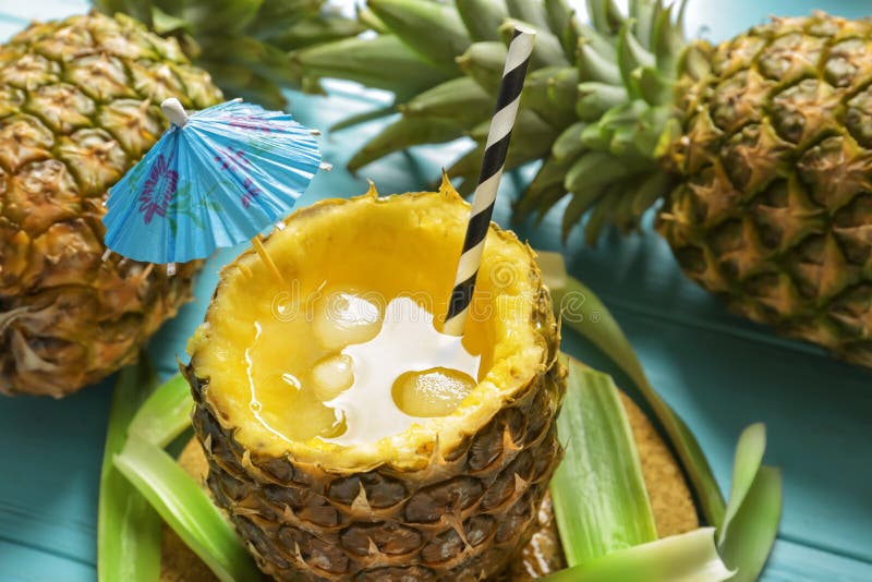 Cold Delicious Cocktail in Pineapple on Table Stock Image - Image of ...