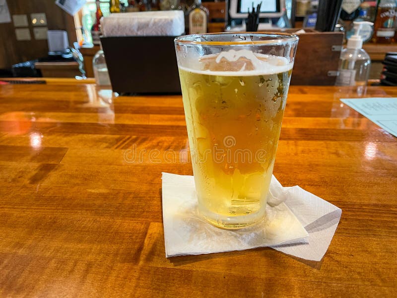 A Cold Draft Beer in a Glass Sitting on a Bar in Florida Stock Image ...