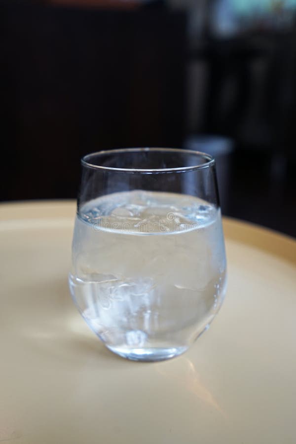 Close Up Glass of Iced Spring Water on Wooden Table Stock Photo - Image ...