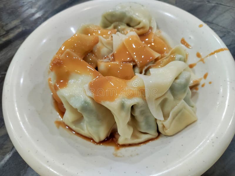 Cold Dumplings with Sesame Sauce on the Plate Stock Image - Image of ...