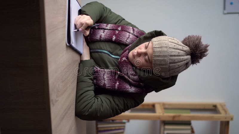Cold Freezing Angry Student Sitting at the Table at Home. a Young Girl ...