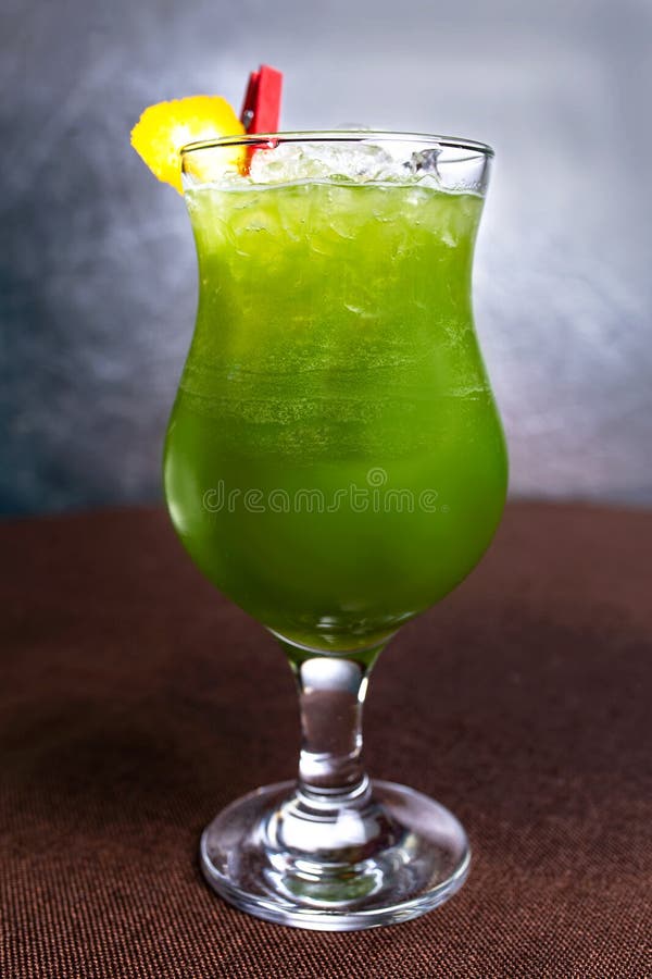 Cold Green Cocktail with Ice and Lemon in the Cafe Stock Photo - Image ...
