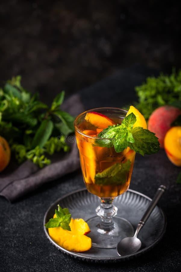 Cold Ice Tea with Peach and Mint Stock Photo - Image of glass, juice ...