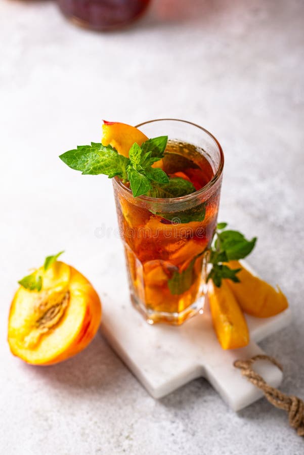 Cold Ice Tea with Peach and Mint Stock Photo - Image of glass ...