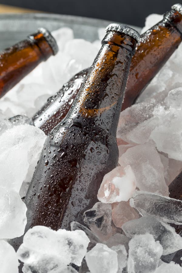Cold Icy Beer Bottles stock photo. Image of liquid, full - 130389826