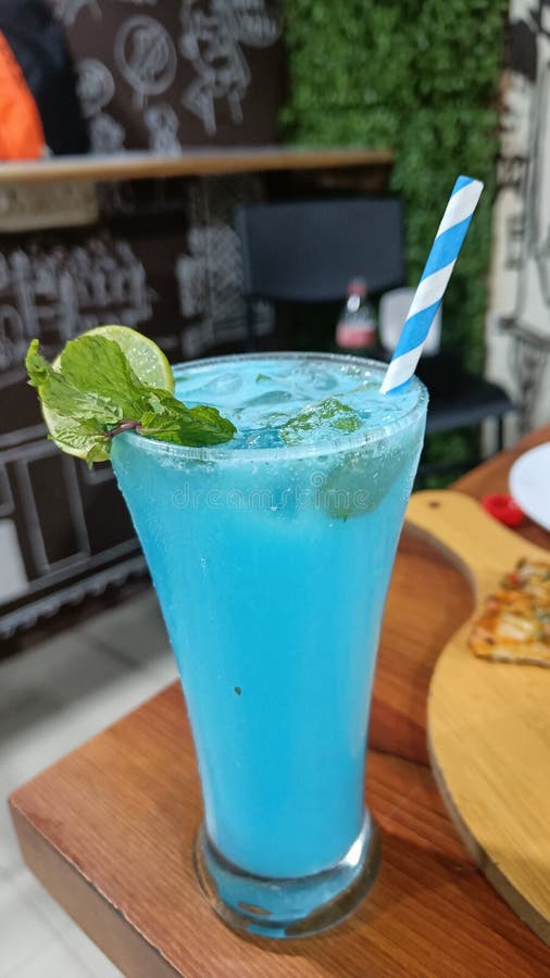 Cold juice 😃 stock image. Image of blue, juice, berey - 258856067