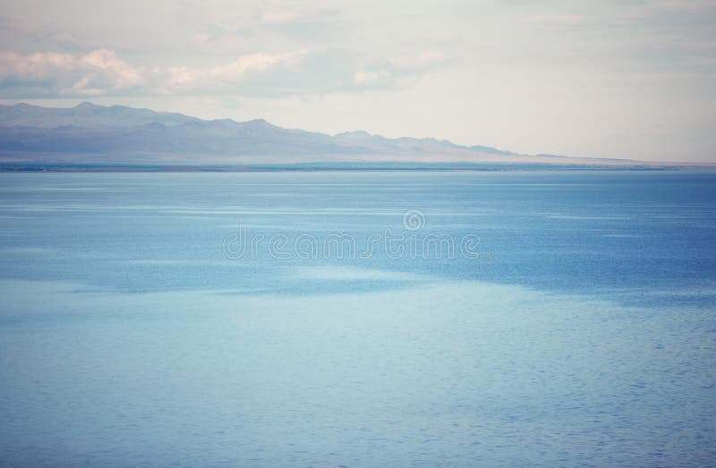 Cold lake with mountains stock image. Image of color - 83549255