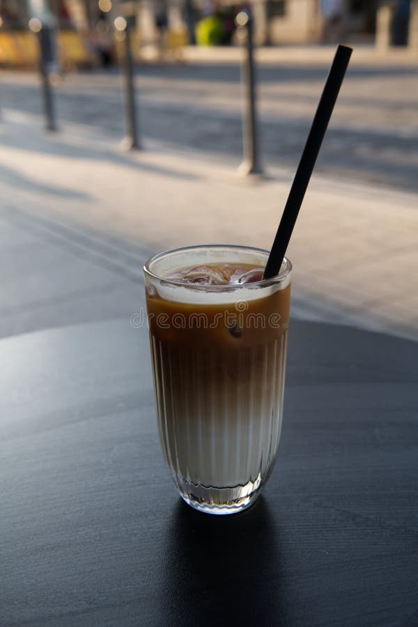 Cold Latte in a Glass with Ice on the Table Stock Image - Image of cold ...