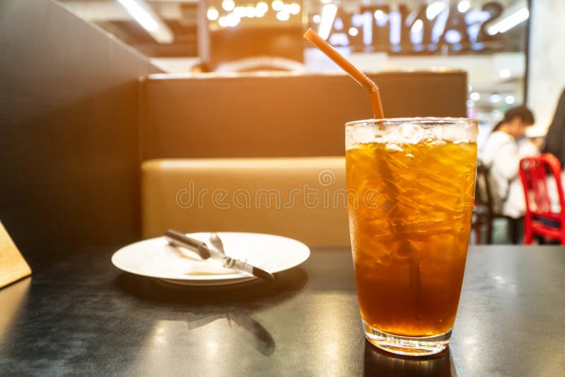 Cold Lemon Tea on the Table. with Plates and Spoons Stock Image - Image ...
