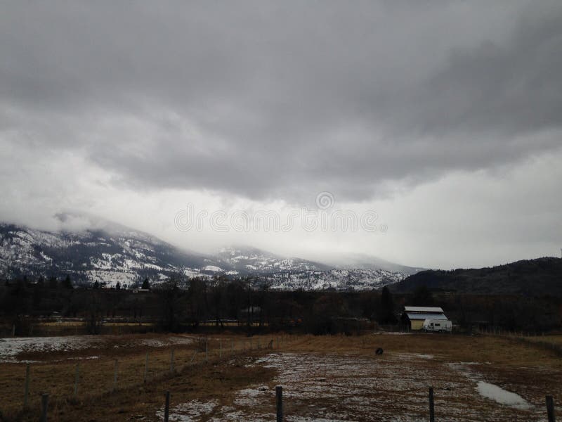 Cold lonely field stock photo. Image of surrounded, mountains - 234197910