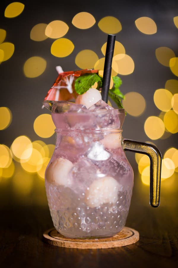 Cold Lychee Juice and Ice in Pitcher with a Piece of Lychee Stock Image ...