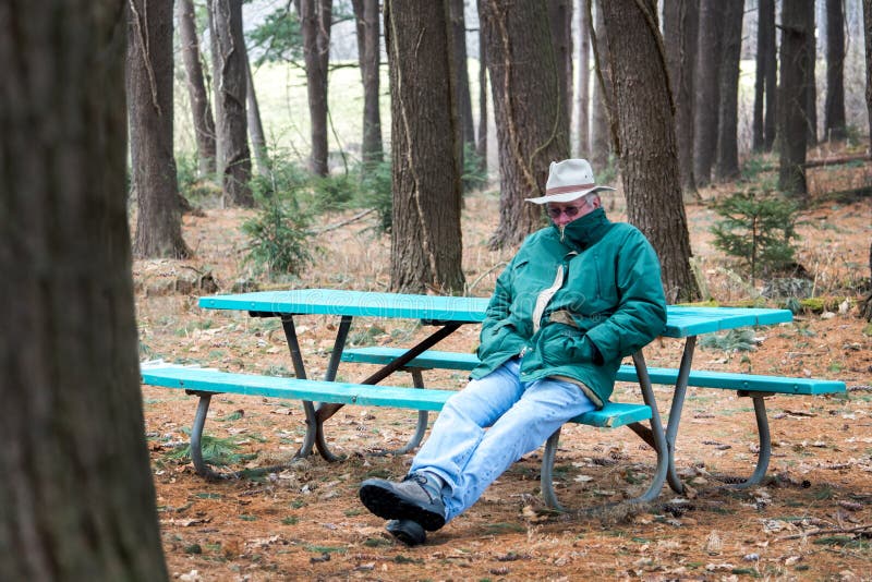 Cold Man at a Picnic Table in Early Spring Stock Image - Image of ...