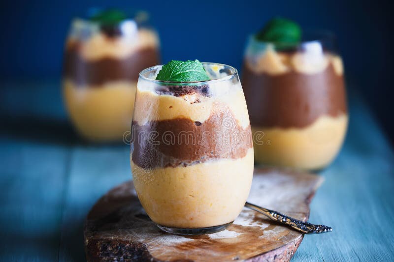 Cold Mango and Chocolate Pudding with Mint Leaves Stock Image - Image ...