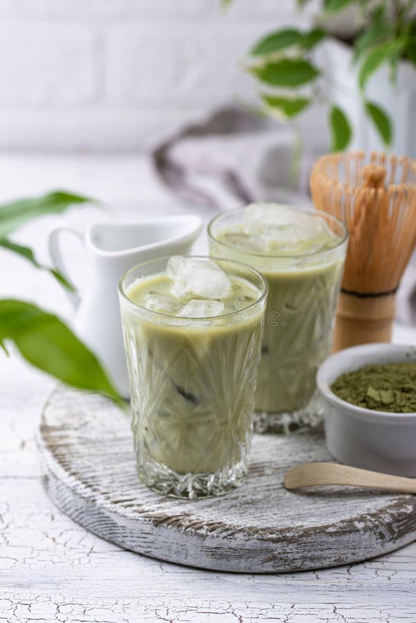 Cold Matcha Tea with Milk and Ice Stock Photo - Image of bamboo, milk ...