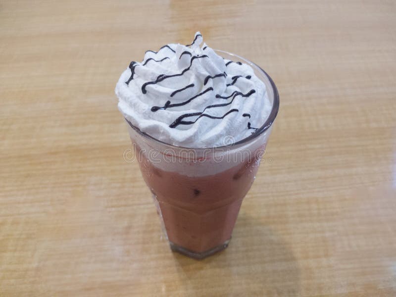 Cold Milk Coffee Drink with Soft Cream on the Table Stock Photo - Image ...