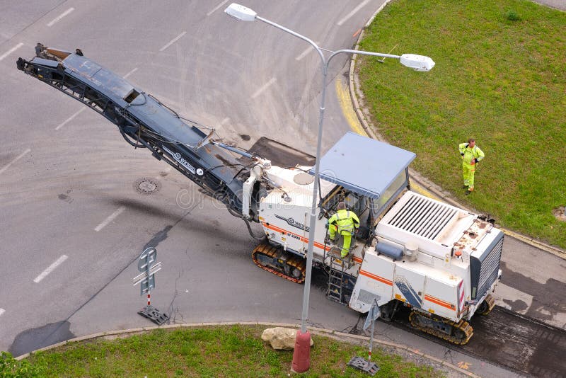 Cold Milling Machine Removing Asphalt Pavement for Repairing the Road ...