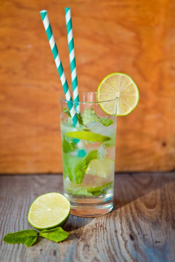 Cold Tea Cocktail with Ice and Straw on Board Stock Image - Image of ...