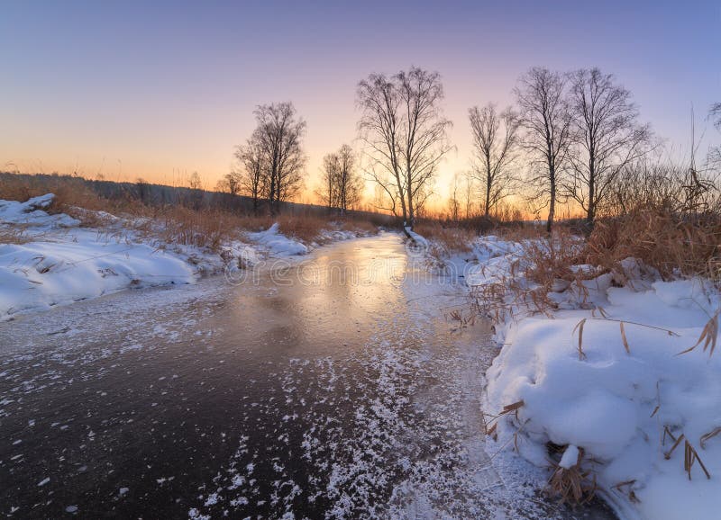 In the Cold Morning the Frozen Small River on Sunrise Stock Image ...