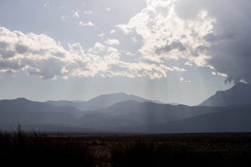 The Cold Mountains with Sun Rays between the Clouds Stock Photo - Image ...
