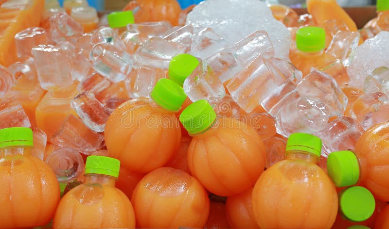 Cold Orange Juice in Bottles Chilled with Ice Stock Image - Image of ...