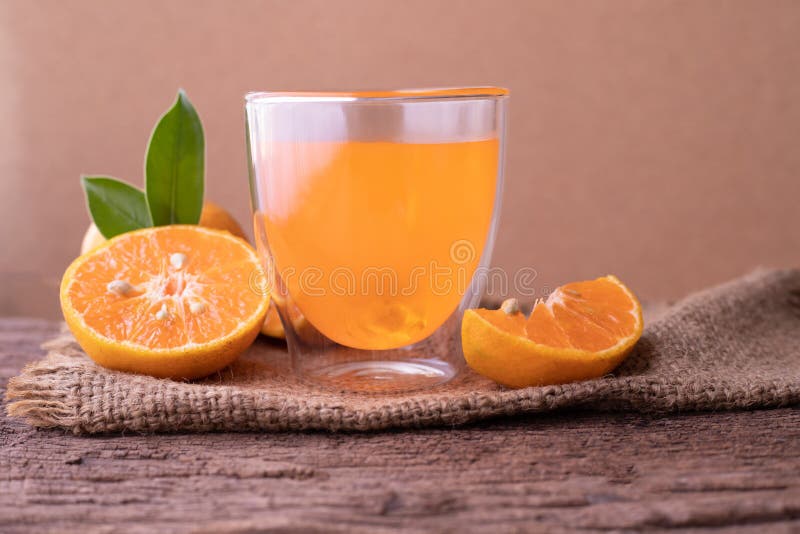 Cold Orange Juice and Sliced Orange on Wood Table Stock Image - Image ...