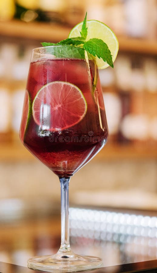 Cold Pink Cocktail with Fresh Grapefruit, Lime and Ice Cubes on ...