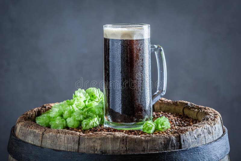 Cold Pint of Dark Beer on Old Barrel Stock Photo - Image of foam, brown ...