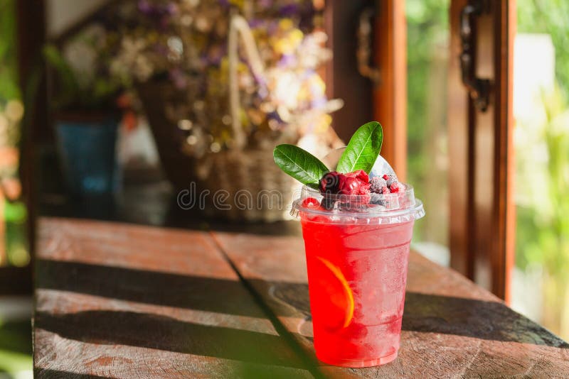 Cold Raspberry Juice with Ice and Leaf Wooden Top. Stock Photo - Image ...