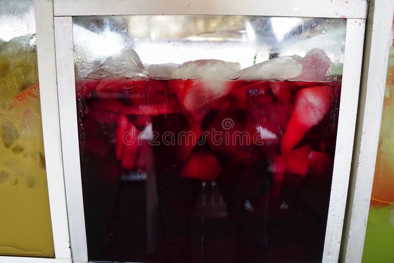 Cold Red Juice with Ice in a Big Container Stock Image - Image of ...