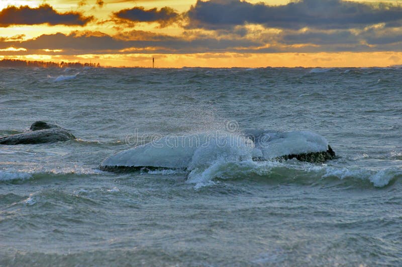 Cold sea sunset stock photo. Image of rock, gold, scenics - 2685308