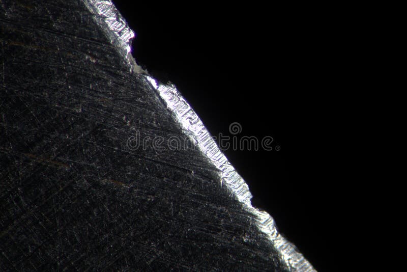 Razor Blade by Microscope. Microscopic Scratched Steel Surface Stock ...