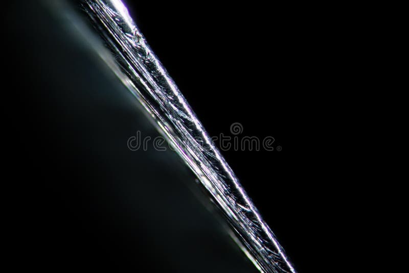 Razor Blade by Microscope. Microscopic Scratched Steel Surface Stock ...