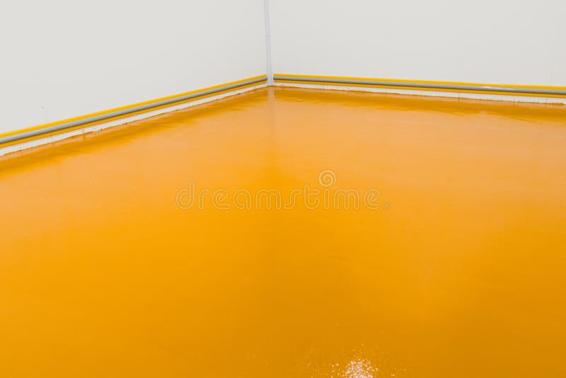 New Polished Concrete Floor Covered with a Layer of Yellow Epoxy Resin ...