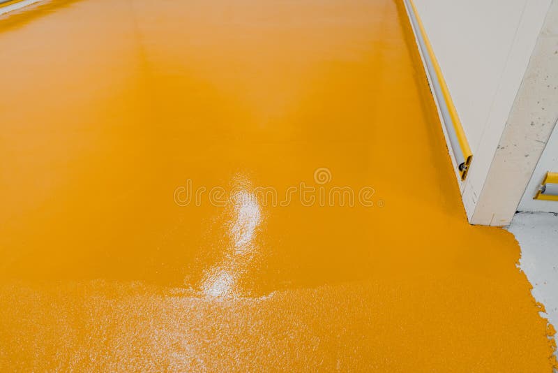 New Polished Concrete Floor Covered with a Layer of Yellow Epoxy Resin ...