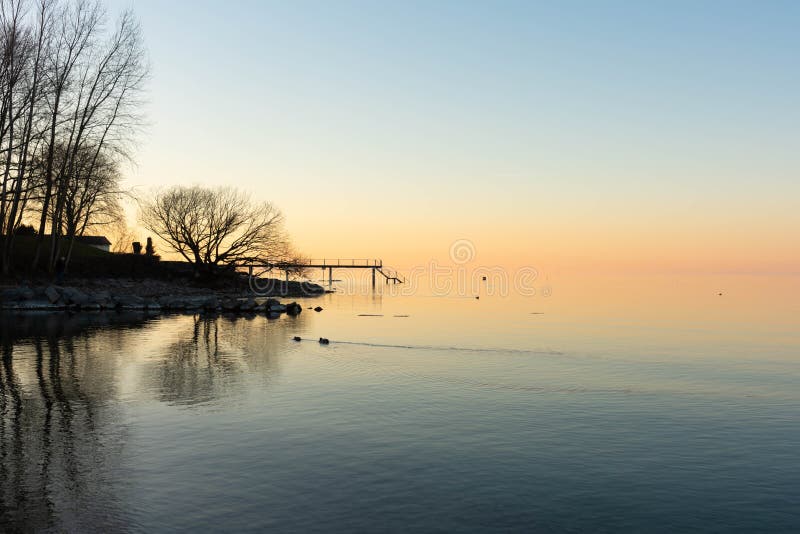 Cold sunset at a lake stock photo. Image of light, bavaria - 143327246