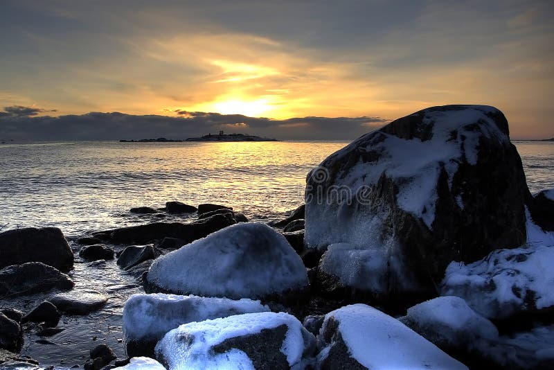 A cold sunset at the sea stock photo. Image of clear, snow - 2116866