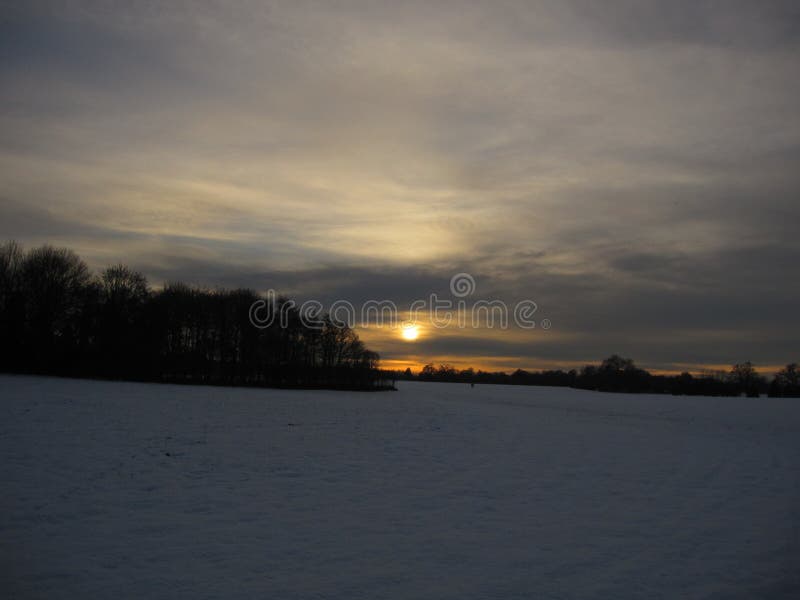 A Cold Sunset stock photo. Image of sunlight, lake, sunrise - 105800100
