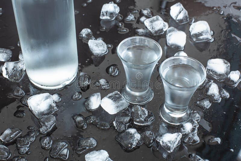 Cold Vodka in Two Glass and Ice on Stock Photo - Image of macro, vodka ...