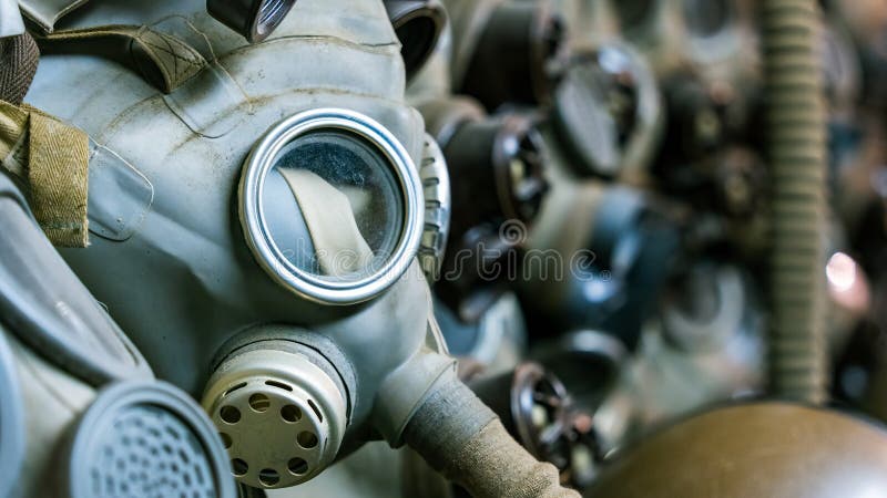 A Cold War Gas Mask on a Wall Stock Photo - Image of wheel, green ...