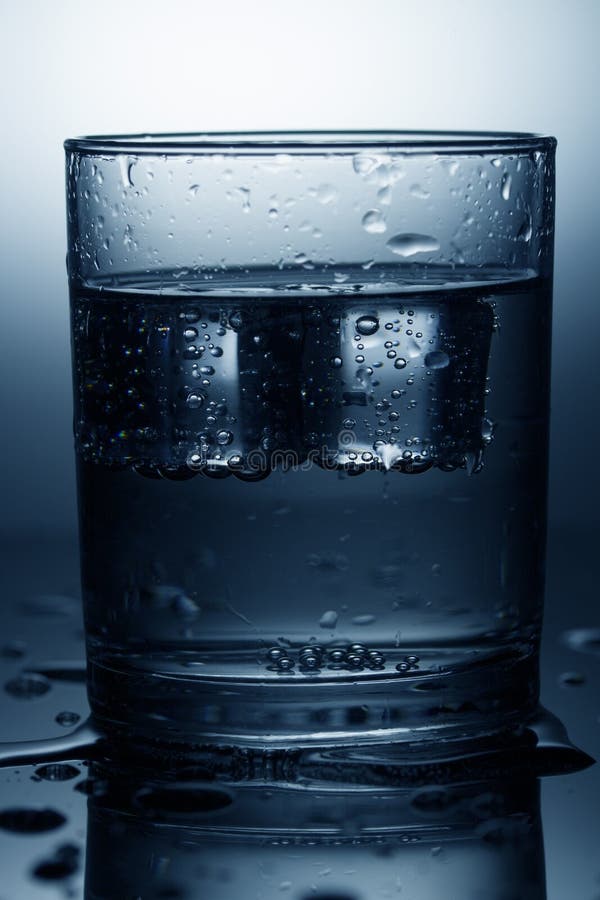 Cold Water with Ice Cubes. Close Up , Toned Stock Photo - Image of ...