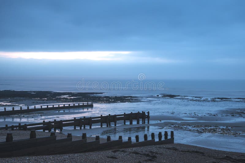 Cold Winter Beach Sunrise Landscape at Low Tide with Dramatic Sk Stock ...