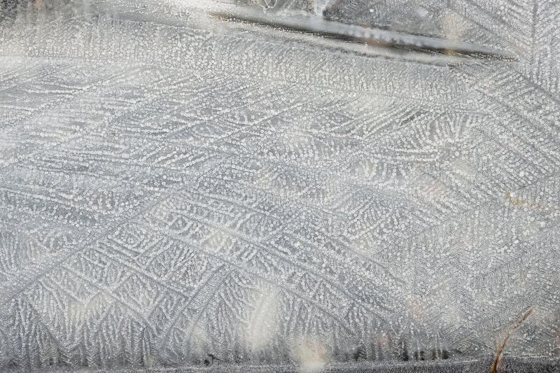 On a Cold Winter Morning in a Rural Setting, a Puddle is Covered in ...