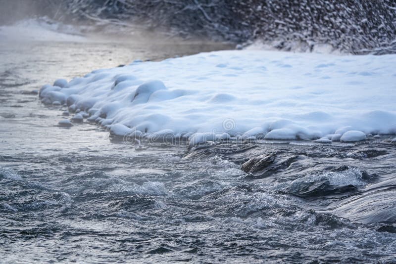 Cold Winter River, Steam Visible Above Water, Dark Trees on Side Stock ...