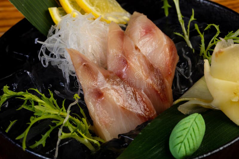 Cold yellowtail sashimi stock photo. Image of cold, black - 127288878