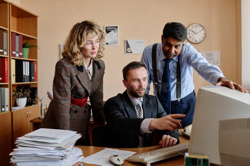 Collaborating on Business Task in Office Setting Stock Image - Image of ...