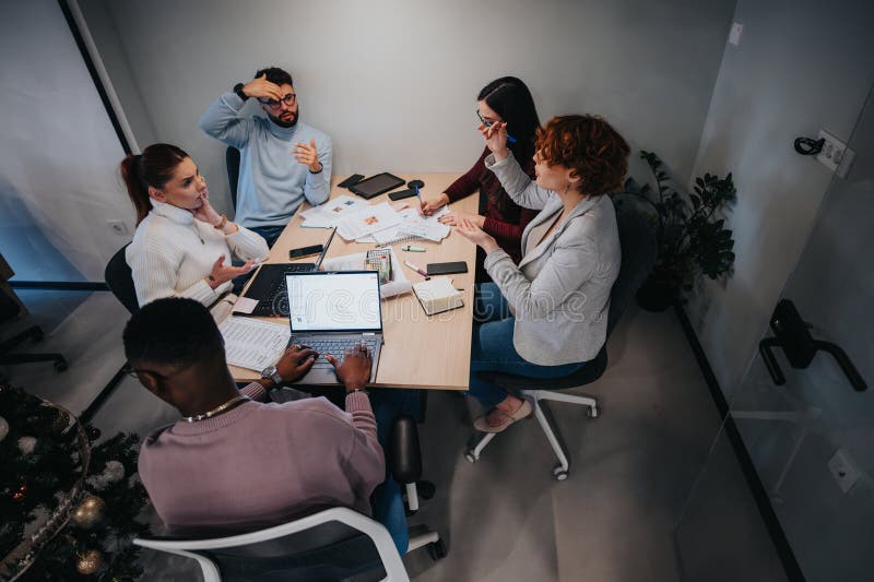 Collaborating Colleagues Analyzing Statistics and Discussing Business ...