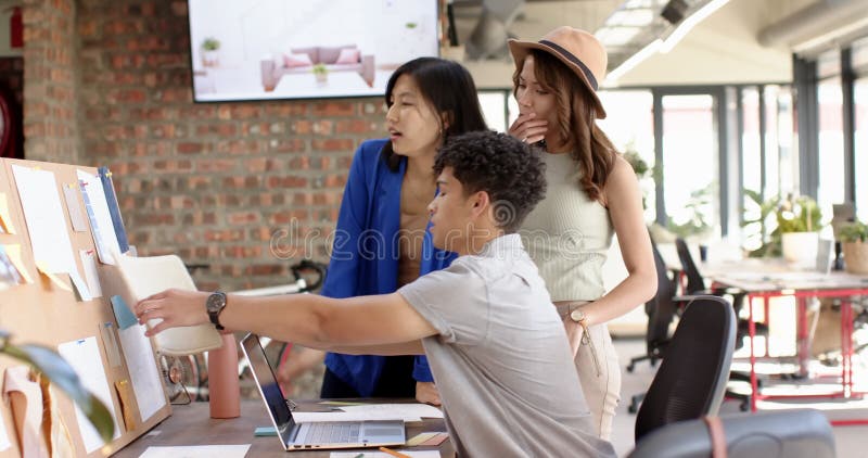 Collaborating on Interior Design Project, Multiracial Team Reviewing ...