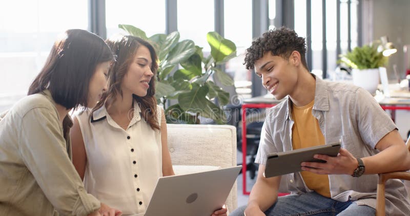 Collaborating on Interior Design Project, Multiracial Team Using Laptop ...